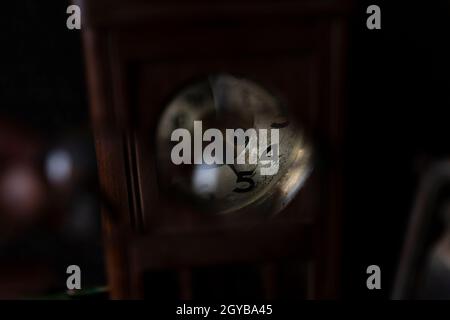 Vintage clock looked through pair of glasses Stock Photo - Alamy