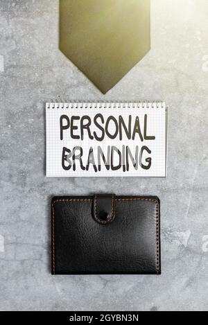 Personal branding words written on ripped paper pieces with brown ...