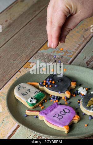 Fresh homemade decorated halloween cookies and sweets on dark ...