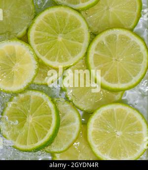 Fresh limes in water with bubbles Stock Photo - Alamy