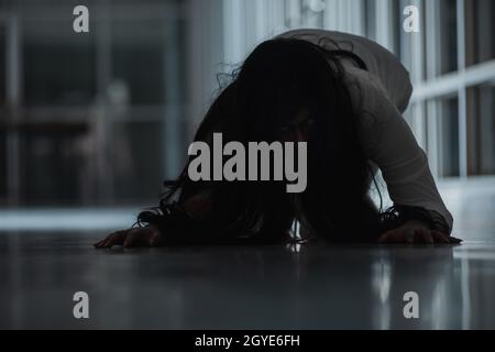 Black and white of a creepy zombie crawling out of the grave Stock ...