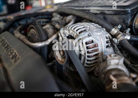 Car engine alternator detail in a mechanical workshop Stock Photo - Alamy