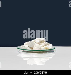 Calcium carbonate Chip in Chemical Watch Glass place next to crystal ...