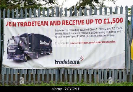 A advert for HGV drivers is displayed at a DHL building in Reading ...