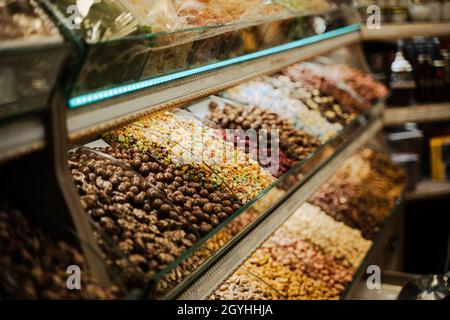 perspective view closeup of rows of assorted chocolate candy ...