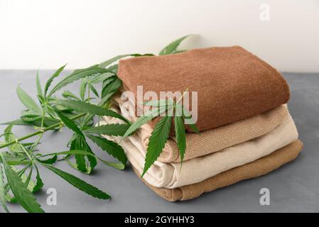 Stack of hemp clothes with cannabis leaf Stock Photo - Alamy