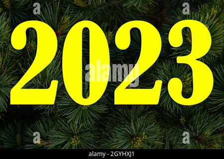 Christmas background with decorative numbers 2023, a star and a knitted ...