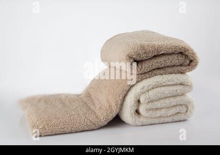 Soft and warm stack of folded blankets isolated on white background ...