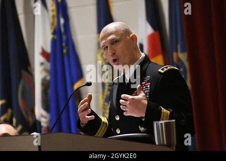 Brig. Gen. Jered P. Helwig stands as his son, Nathan, and his wife ...