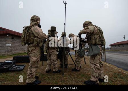 Airmen assigned to the 3d Weather Squadron set up a tactical ...