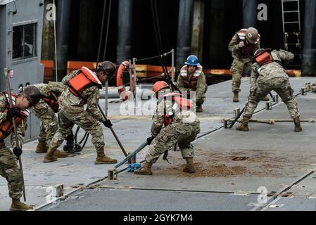 Soldiers of the 331st Transportation Company (Causeway) assemble a ...