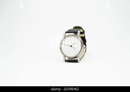 men's watch with a white dial. without numbers. dark background Stock ...
