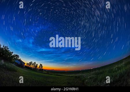Circumpolar star trails with noctilucent clouds Stock Photo - Alamy