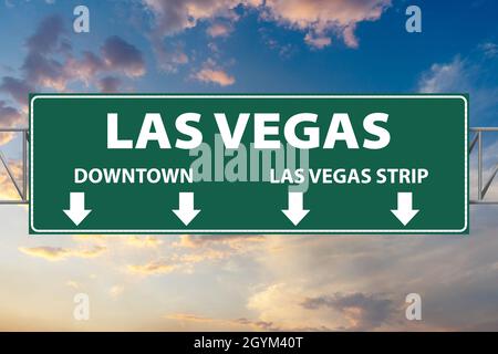 Las Vegas highway sign with sunset sky Stock Photo - Alamy