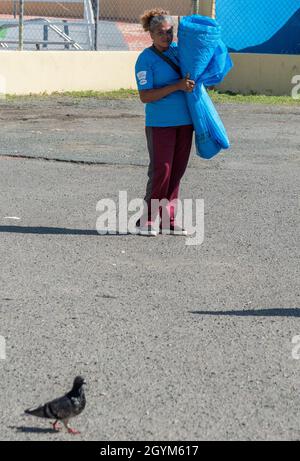 Yauco, PR, January 27, 2020 -- FEMA blue tarps were measured and cut ...