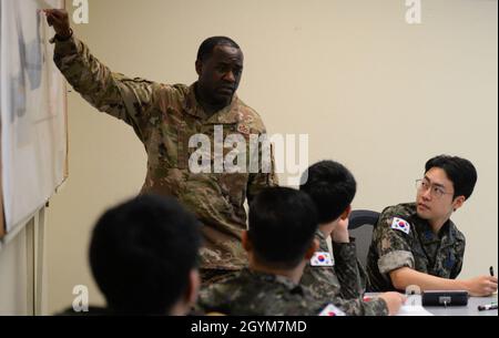 Members of the 554th Civil Engineering Squadron (Red Horse) pour ...