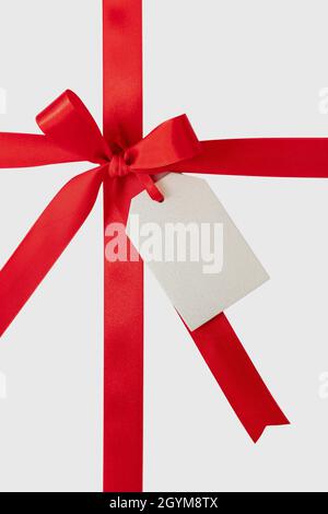 Gift card note with ribbon on isolated background Stock Photo - Alamy