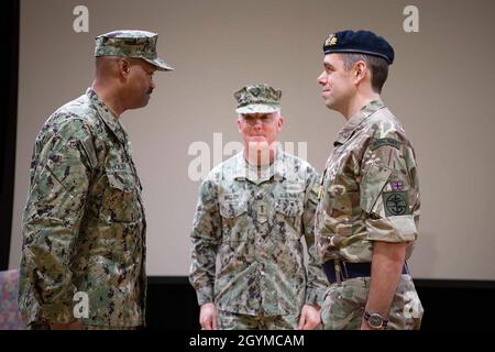 Navy Adm. Alvin Holsey, right, applauds as his wife Stephanie Holsey is ...