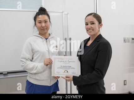 U.S. Navy Lt. Cmdr. Jennifer Forbus, left, the executive officer of the ...