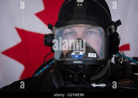 Royal Canadian Navy Leading Seaman Jeff Dubinsky is outfitted in his ...