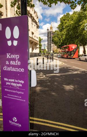 Blue footpath sign, street furniture, with Big Ben in the background ...