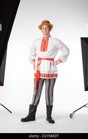 Beautiful young man in Belarusian national costume isolated on white ...