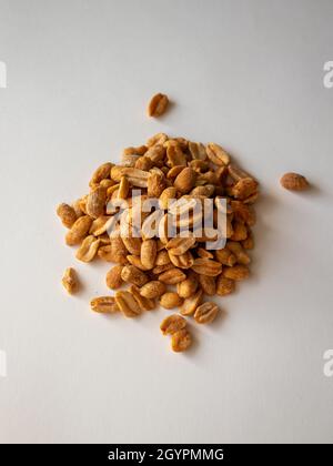 Roasted chili lemon peanuts on white background Stock Photo - Alamy