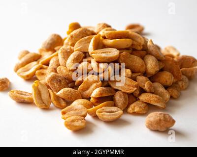 Roasted chili lemon peanuts on white background Stock Photo - Alamy