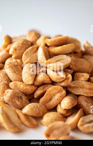 Roasted chili lemon peanuts on white background Stock Photo - Alamy
