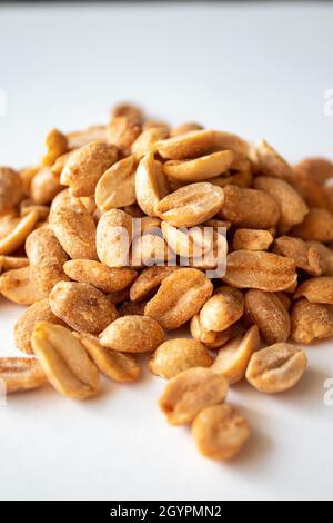 Roasted chili lemon peanuts on white background Stock Photo - Alamy