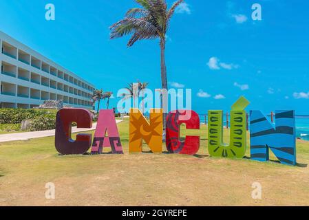 Cancun name sign at park against sea and sky Stock Photo - Alamy