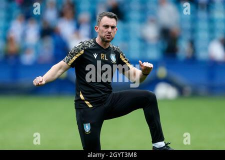 Rob Lee warms the players up before kick off Stock Photo - Alamy