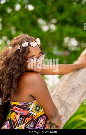 Beautiful young multiracial female model posing in a colorful dress at ...