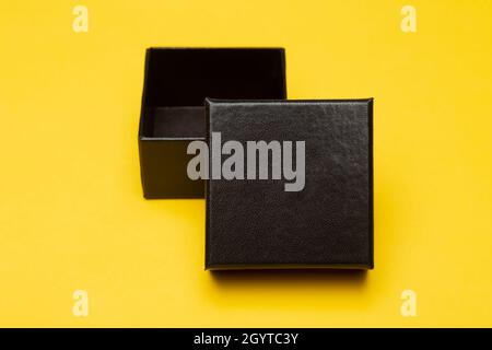 Mini black box product packaging isolated on yellow background Stock ...