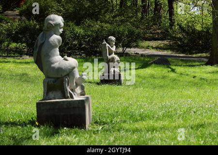 An old angel sculpture in the clearing of the city museum Stock Photo ...