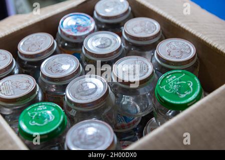 Empty pots of baby food. Glasses packaged in a cardboard box. Objects ...