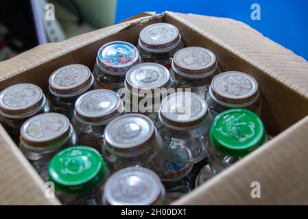 Empty pots of baby food. Glasses packaged in a cardboard box. Objects ...