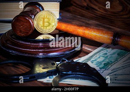 bitcoin, judge's hammer, handcuffs. Concept bitcoin ban, violation of ...