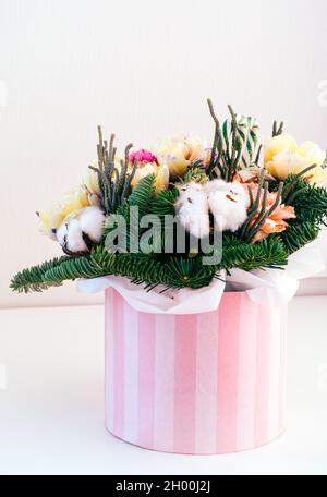 Beautiful winter floral composition with tulips, carnations, cotton ...