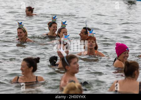 Swimmers participate in a community swim at Coogee beach in Sydney ...
