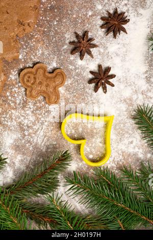 Sprinkled flour and heart shaped cookie cutters on table. Valentines ...