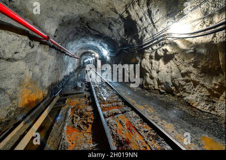 Underground mine railway for transporting ore. Freight trolleys and ...
