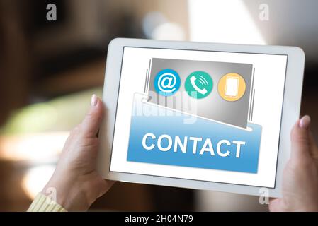 Tablet screen displaying a contact concept Stock Photo - Alamy
