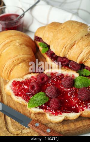 Concept of delicious food with croissants with raspberry jam on white ...