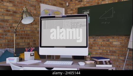 Computer screen with data processing standing on desk in office Stock ...