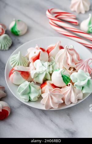 Peppermint meringues on a marble table, Christmas background Stock ...