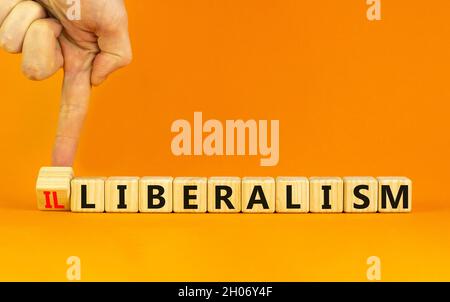 Illiberalism or liberalism symbol. Businessman turns cubes and changes ...