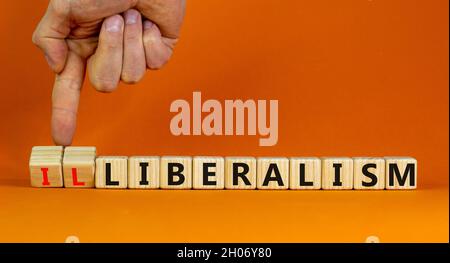 Illiberalism or liberalism symbol. Businessman turns cubes and changes ...