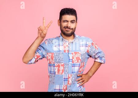 Funny guy winking and showing hand hearts sign, feeling romantic and ...