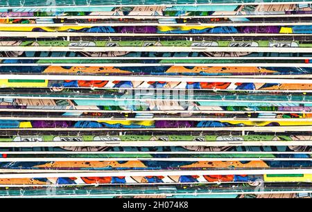 Old faded comic book collection stacked in a pile creates a colorful ...
